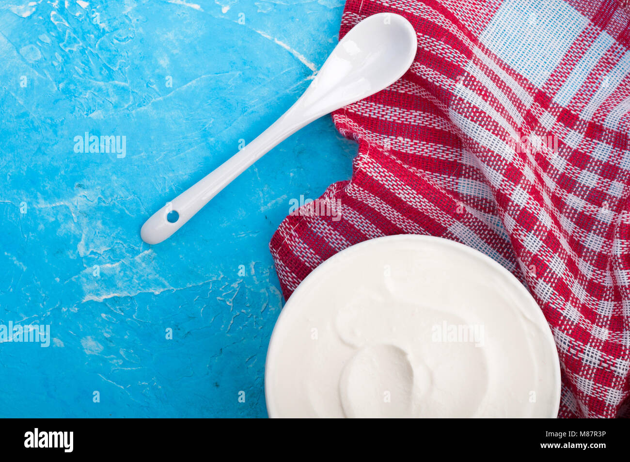 Yogurt on blue background. Dairy product. Healthy food and diet concept ...