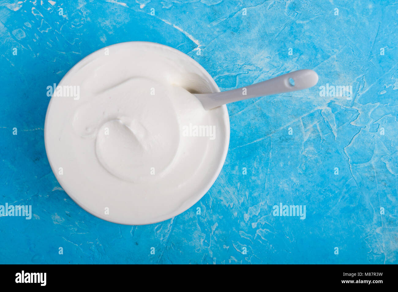 Yogurt on blue background. Dairy product. Healthy food and diet concept ...
