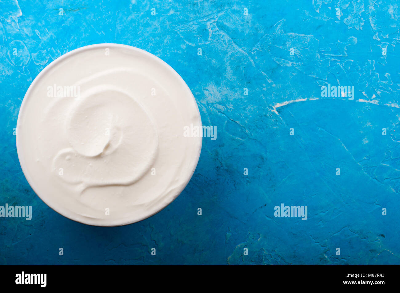 Yogurt on blue background. Dairy product. Healthy food and diet concept ...