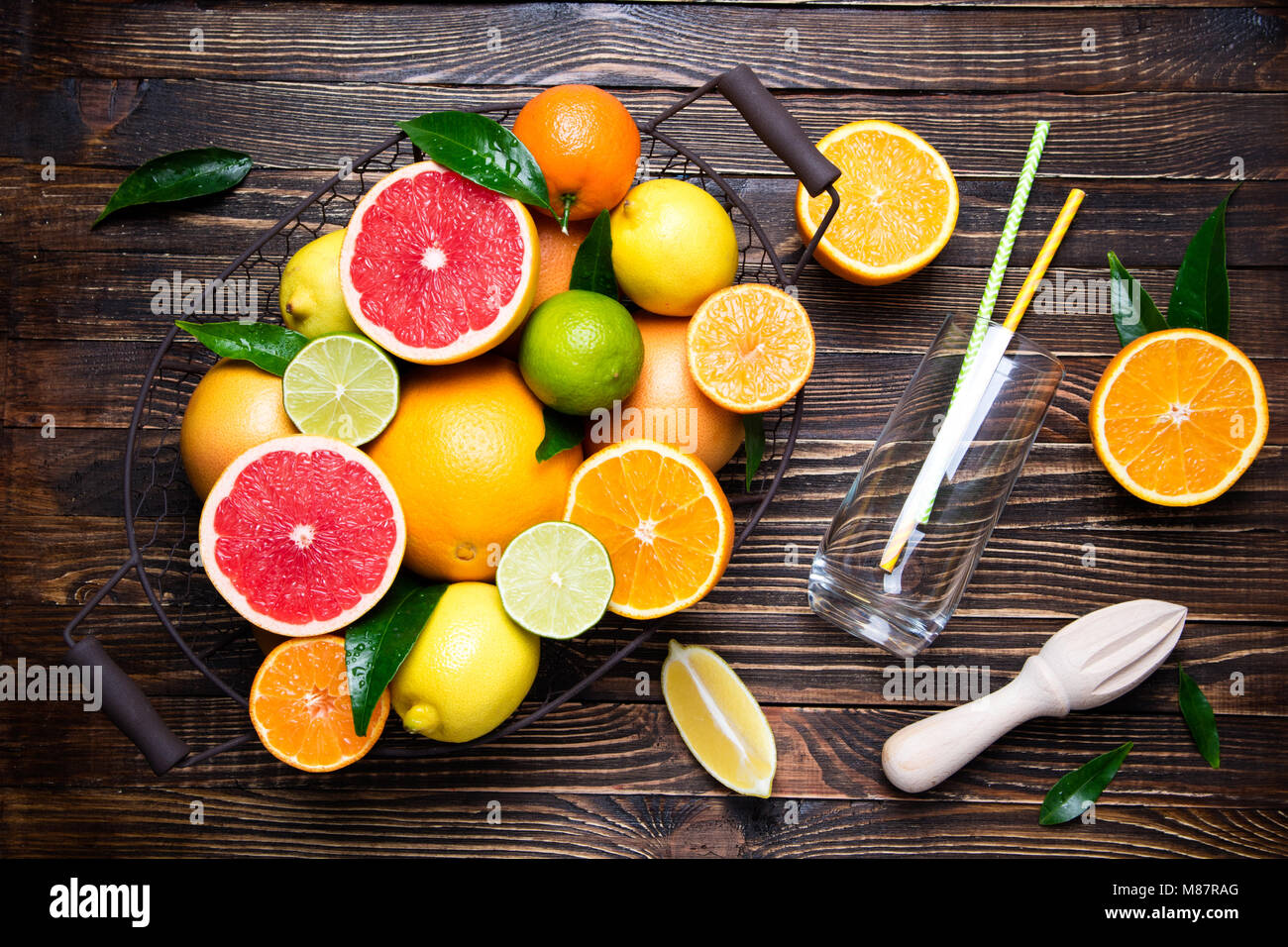 Citrus fruits background. Assorted fresh citrus fruits with leaves ...