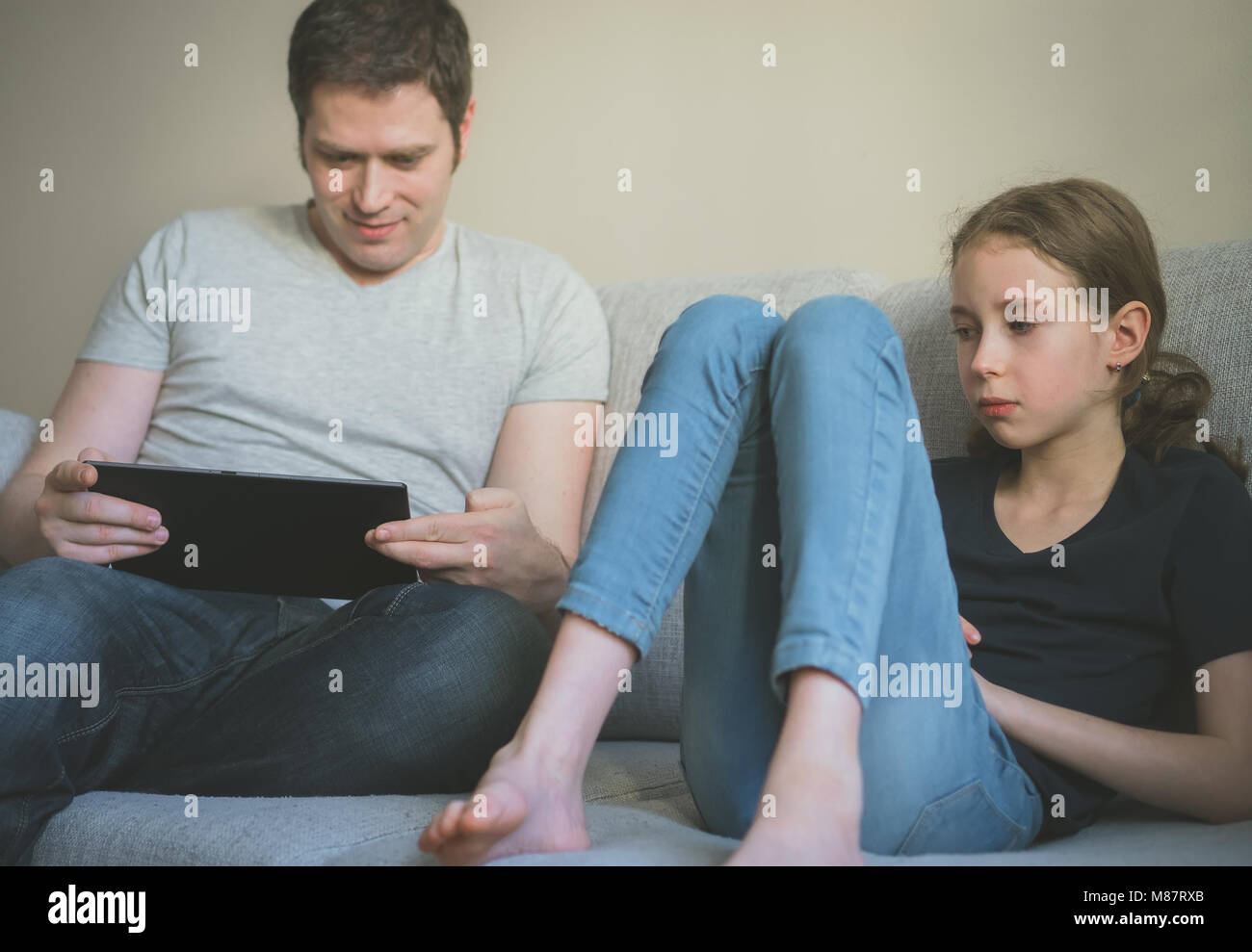Father ignoring child hi-res stock photography and images - Alamy