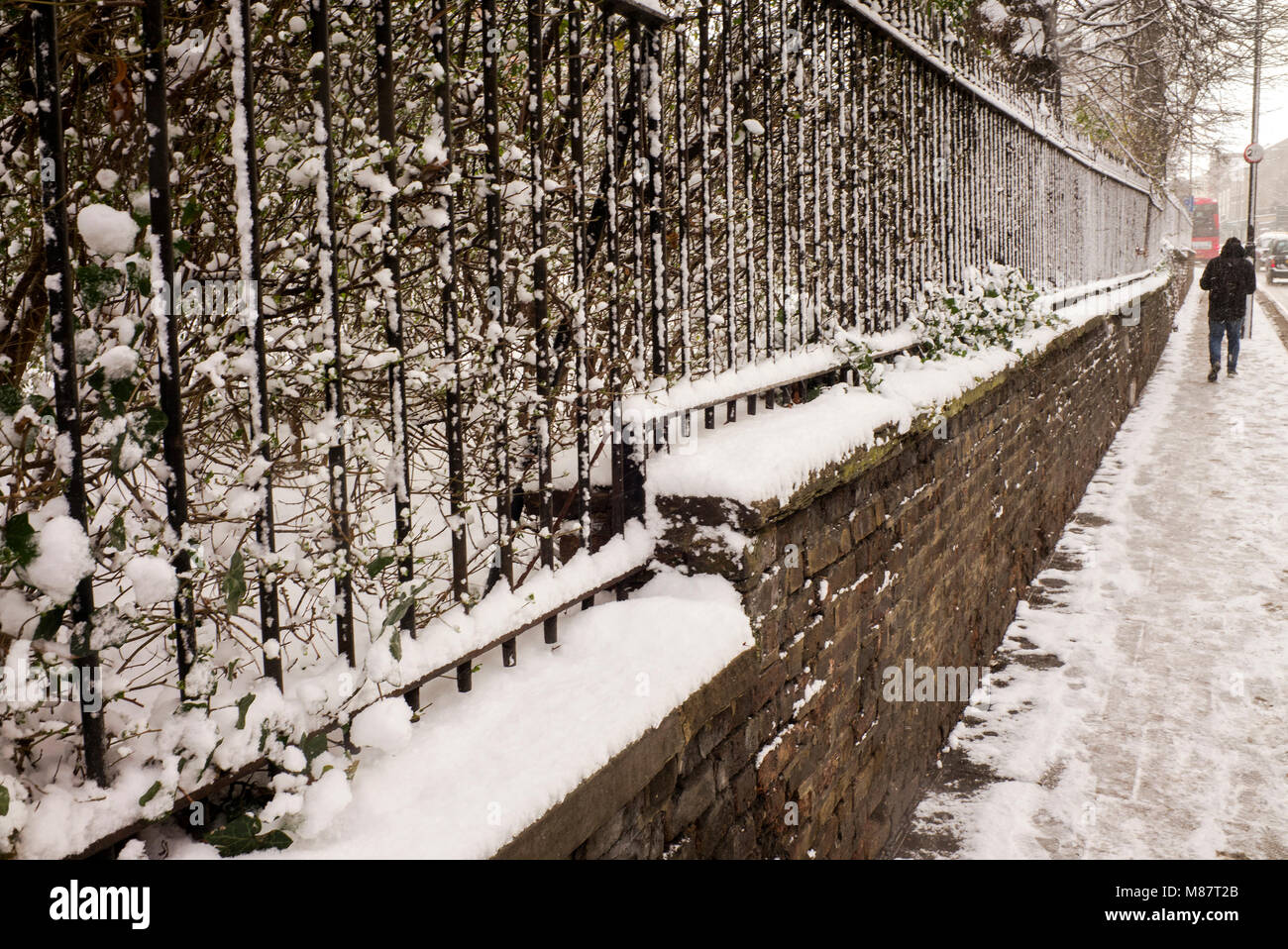 path and park railings covered in snow London Stock Photo - Alamy