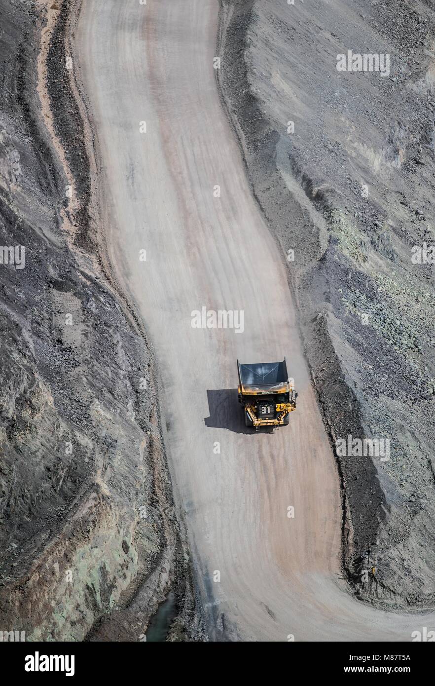 Panoramic view of open pit mine and blue sky located in the desert of ...