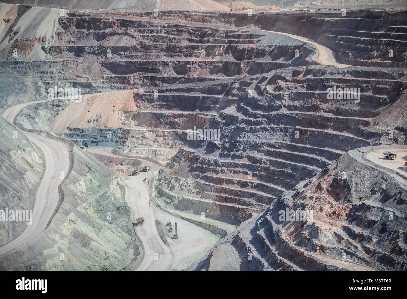 Panoramic view of open pit mine and blue sky located in the desert of ...