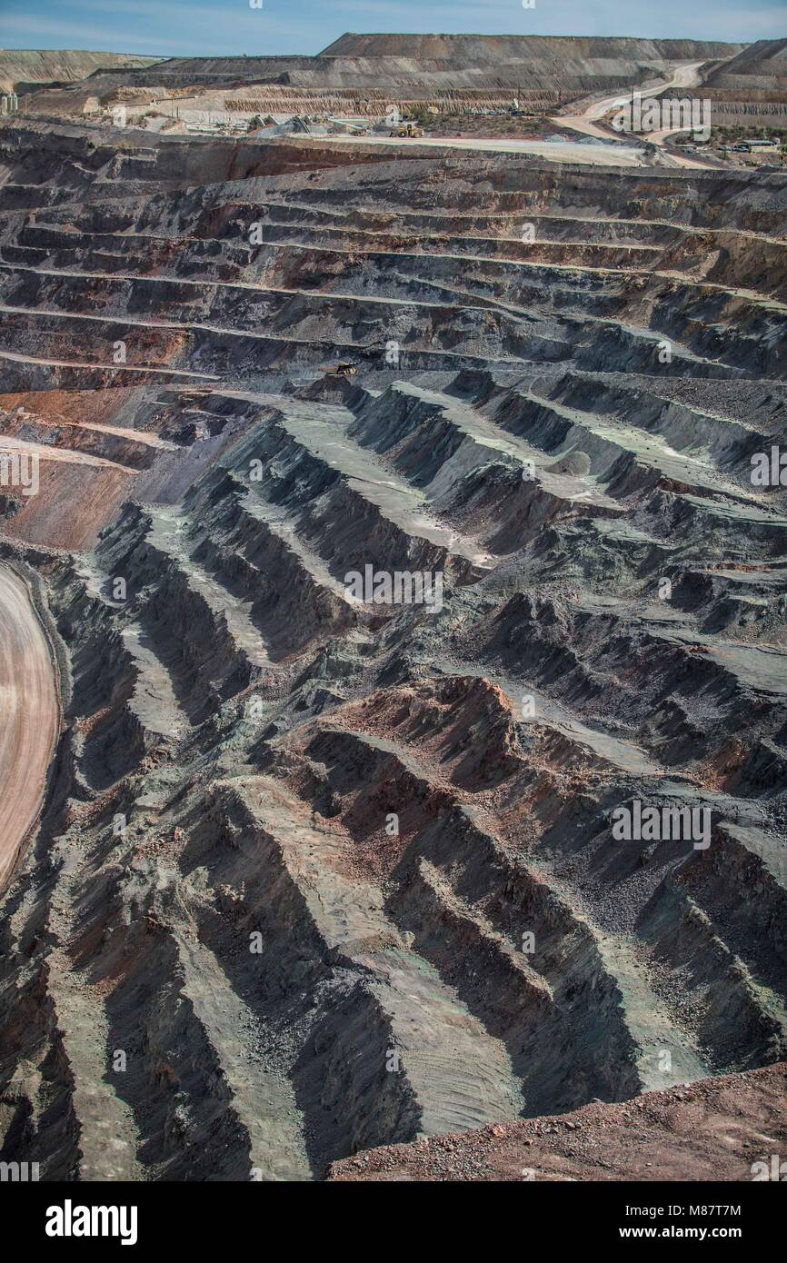 Panoramic view of open pit mine and blue sky located in the desert of ...