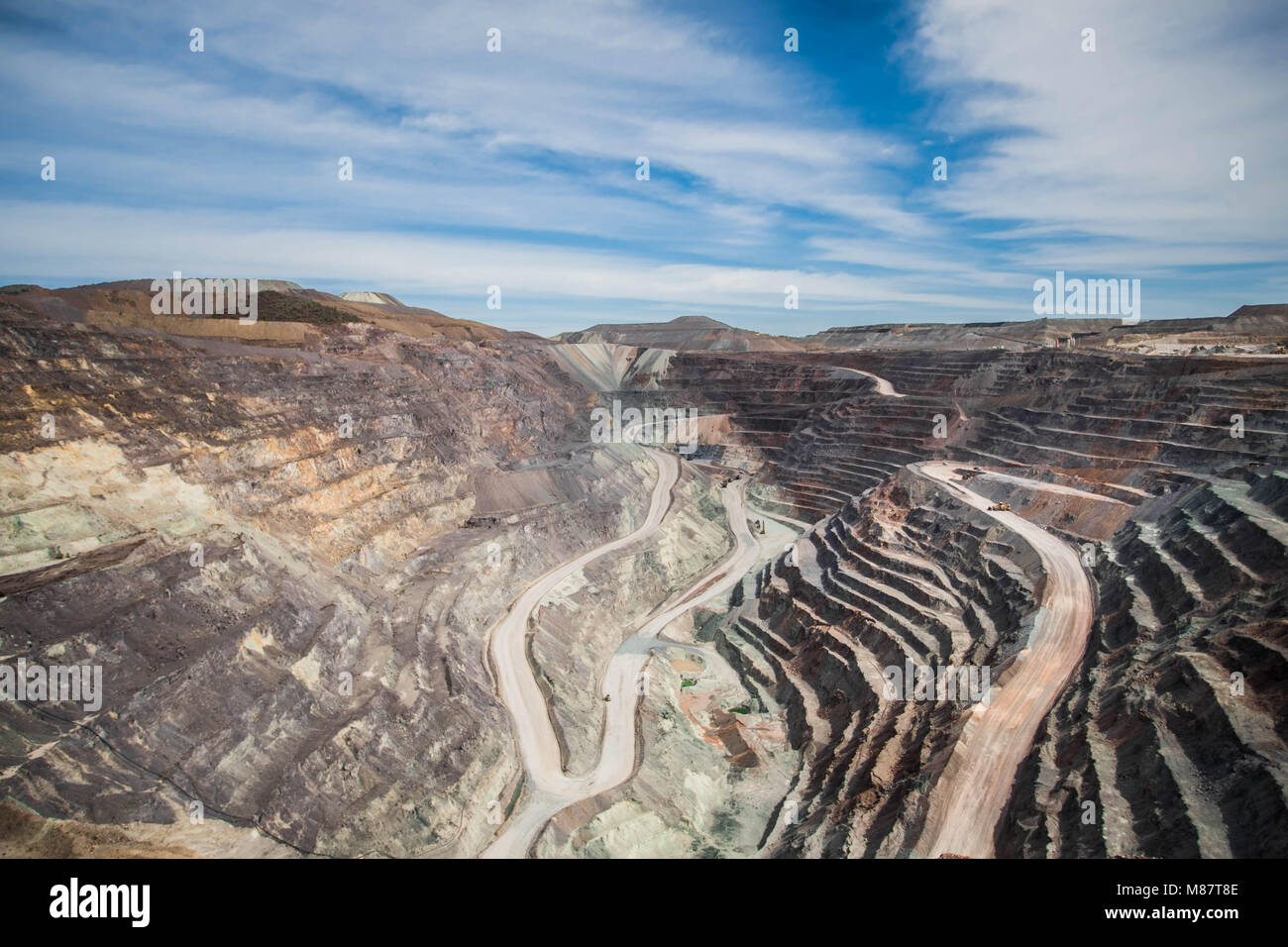 Panoramic view of open pit mine and blue sky located in the desert of ...