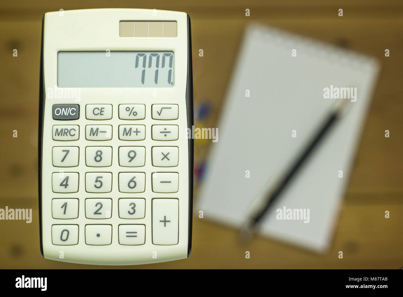 Closeup of calculators on a wooden background with a notebook Stock ...