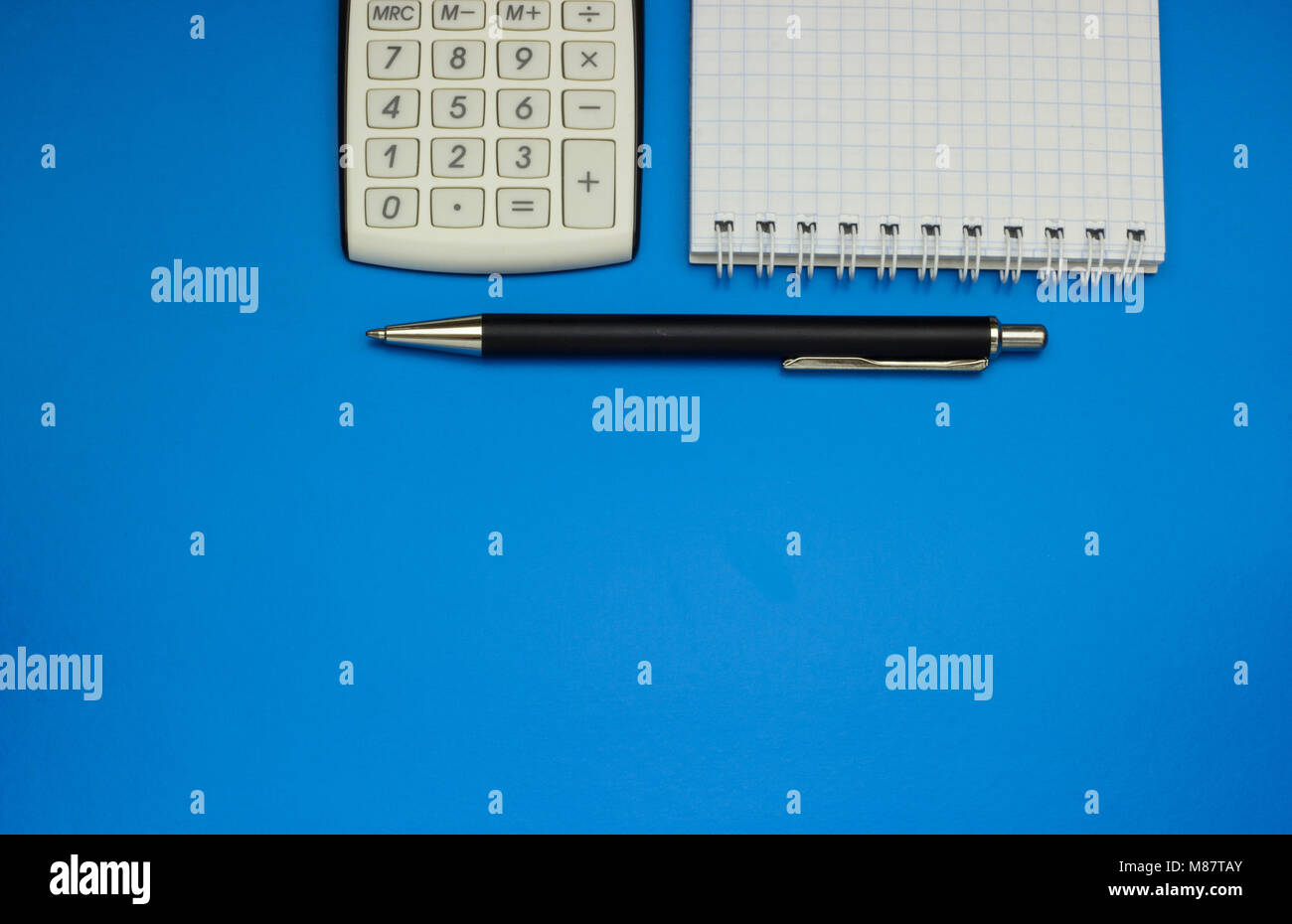 Top view office table calculator with pen on the table for business and ...