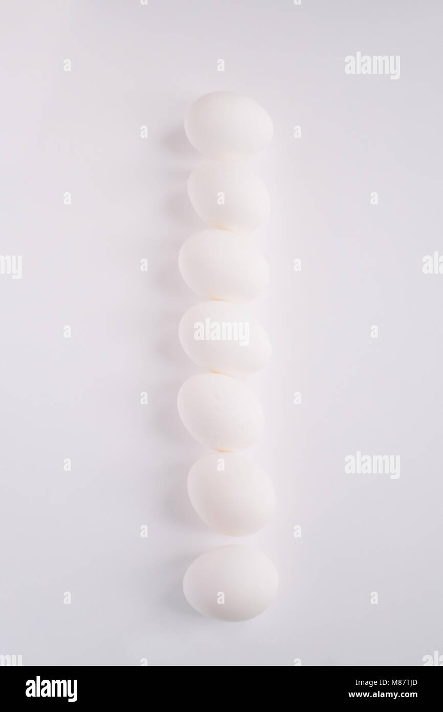 A white egg on a white background. View from the top Stock Photo - Alamy