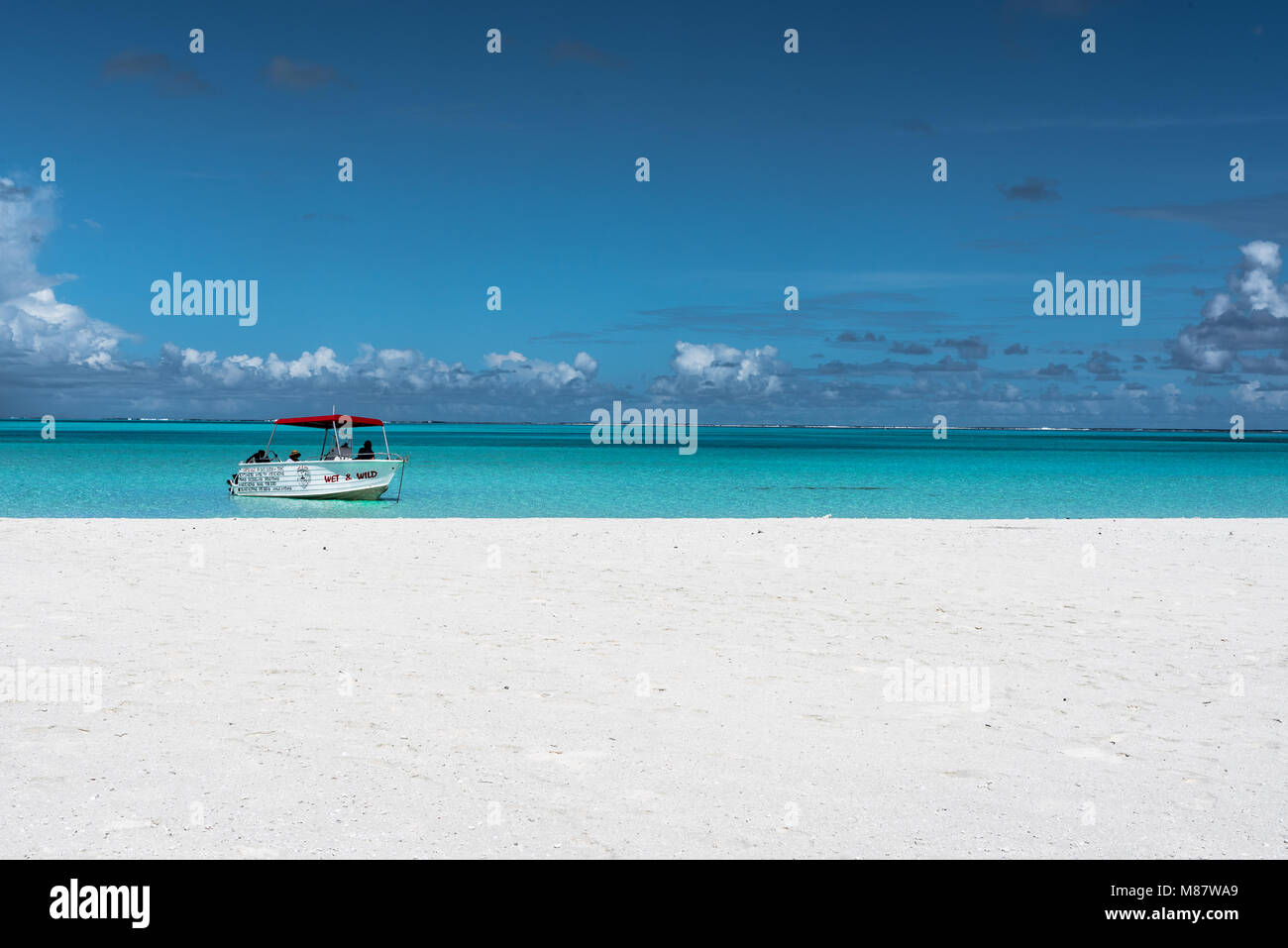 Maina Island, Cook Islands, South Pacific--March 14, 2018. A party boat ...