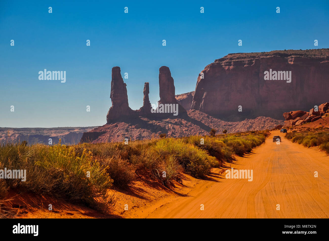 Driving through iconic Monument Valley in Arizona Stock Photo - Alamy