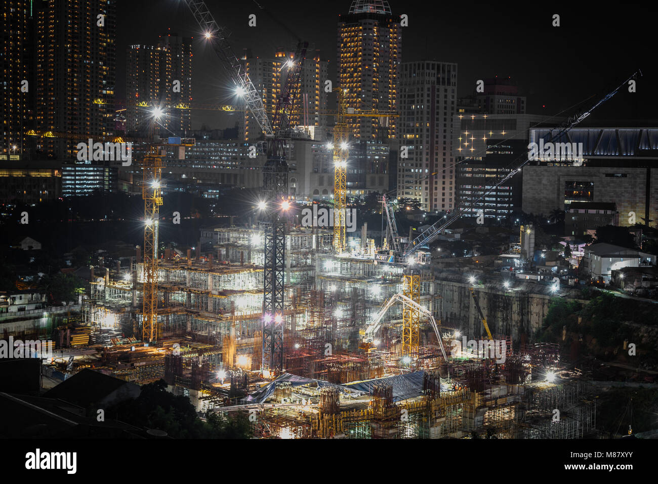 Building construction site at night. Ground breaking construction of ...
