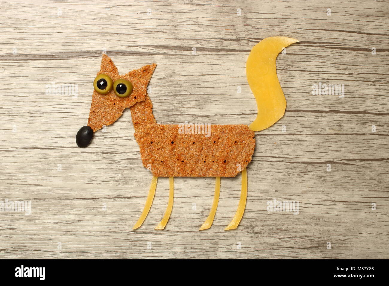 Fox made with bread and cheese on wooden board Stock Photo - Alamy