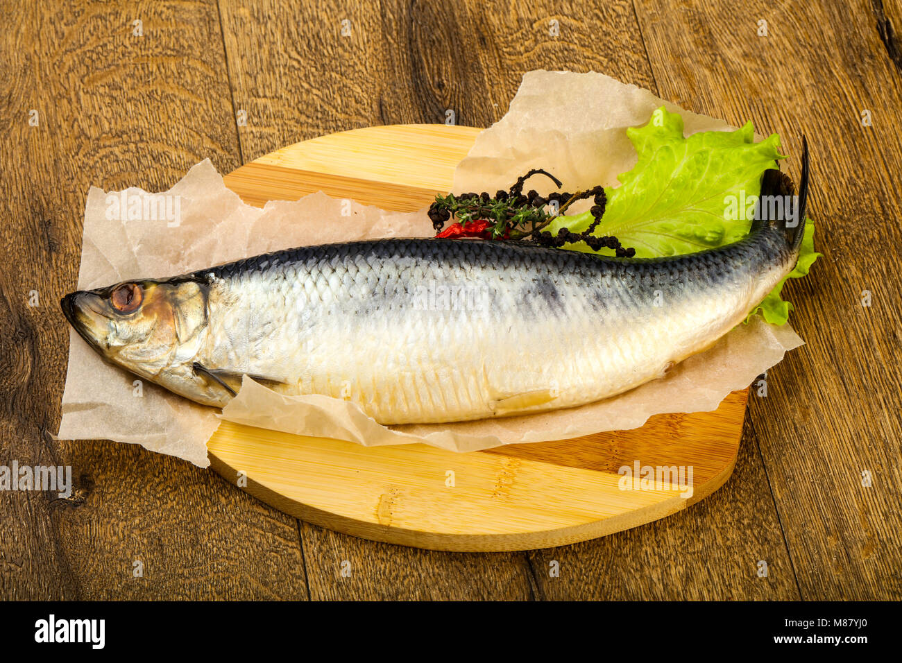 Salted Herring fish with pepper and spices Stock Photo - Alamy