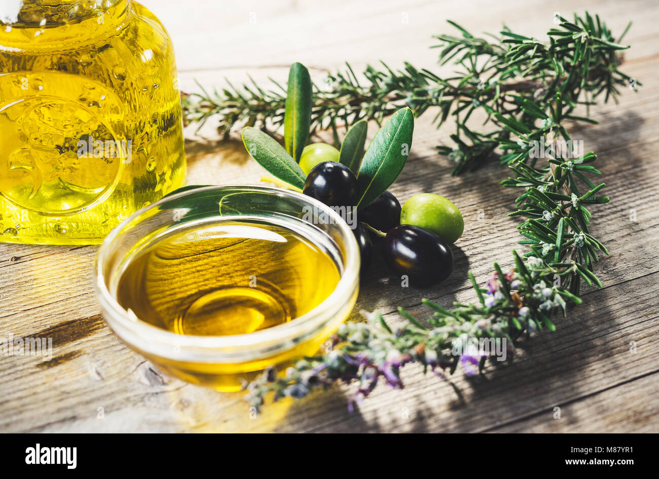 Olive oil with leaves and olives Stock Photo - Alamy