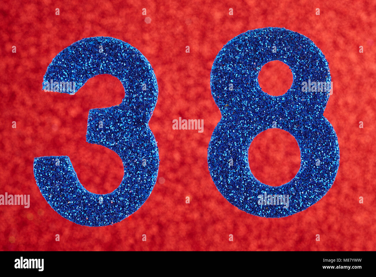Number thirty-eight blue color over a red background. Anniversary ...