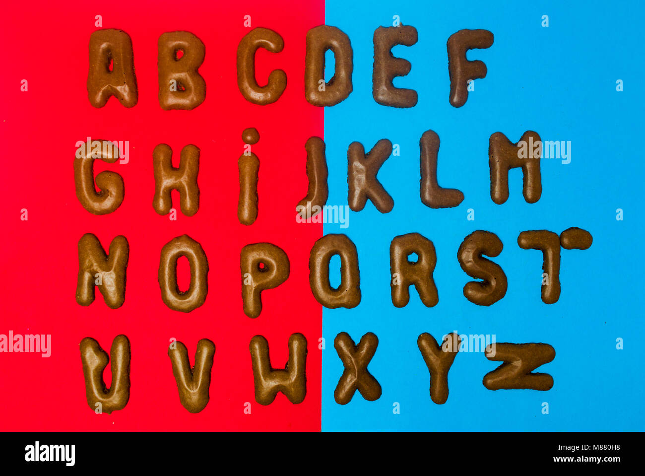 Alphabet made of chocolate cookies red and blue background Stock Photo ...