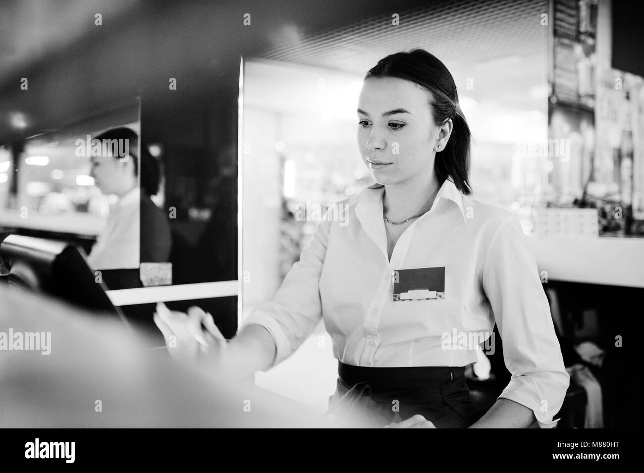 Waiter girl working with pos terminal or cashbox at cafe. People and ...
