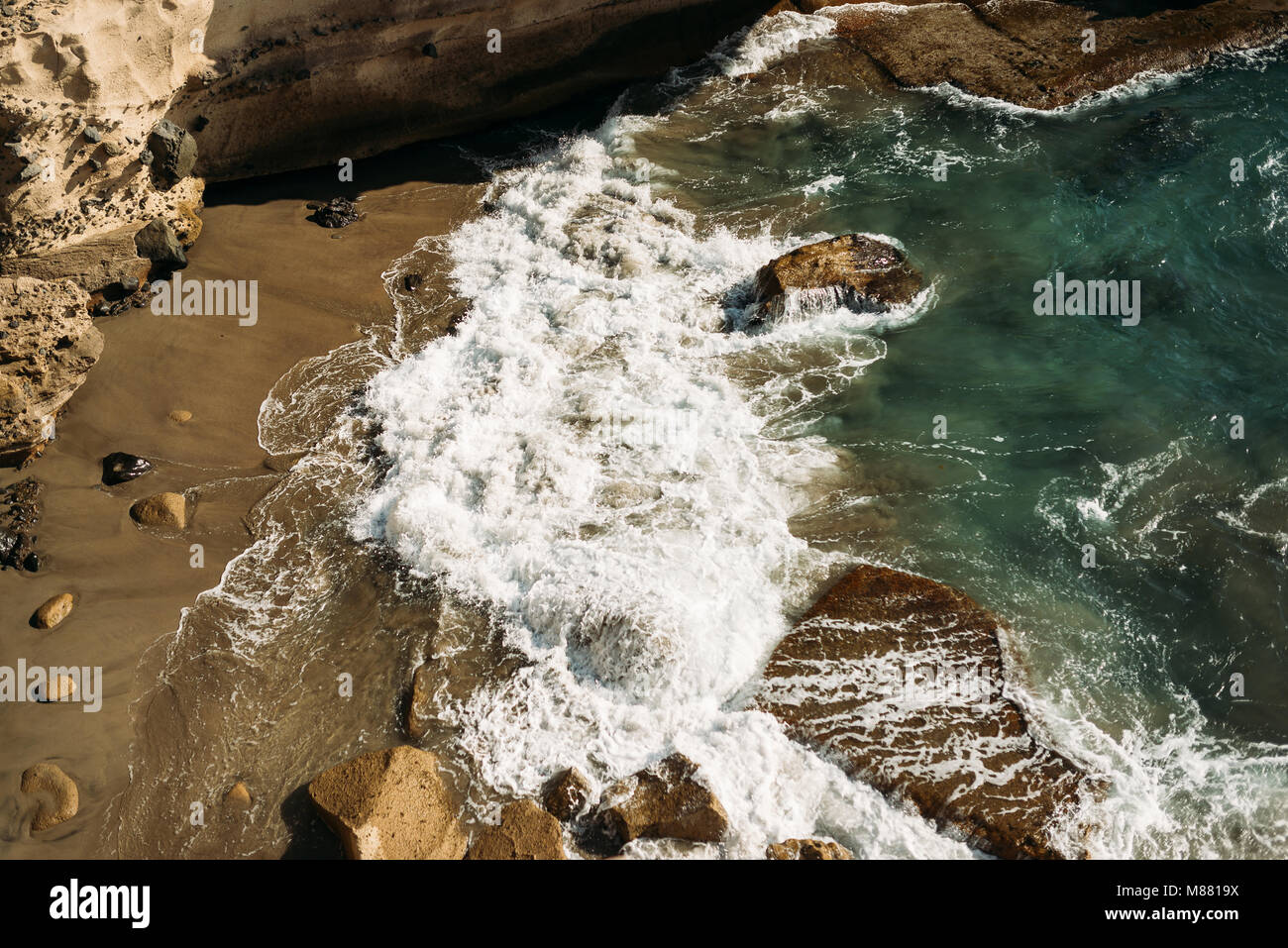 Waves crashing breaking on the rocks. Drone aerial sea view Stock Photo ...