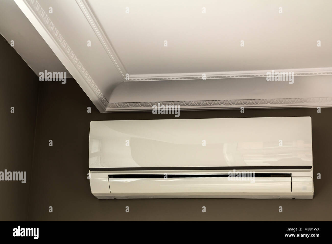 Cool air conditioner system on dark wall in room interior Stock Photo ...