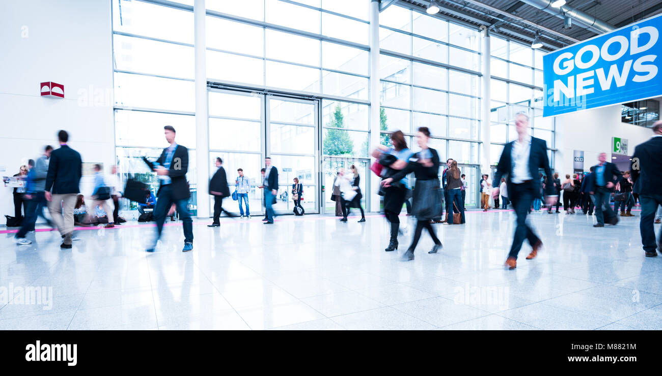 blurred people at a trade fair hall Stock Photo - Alamy