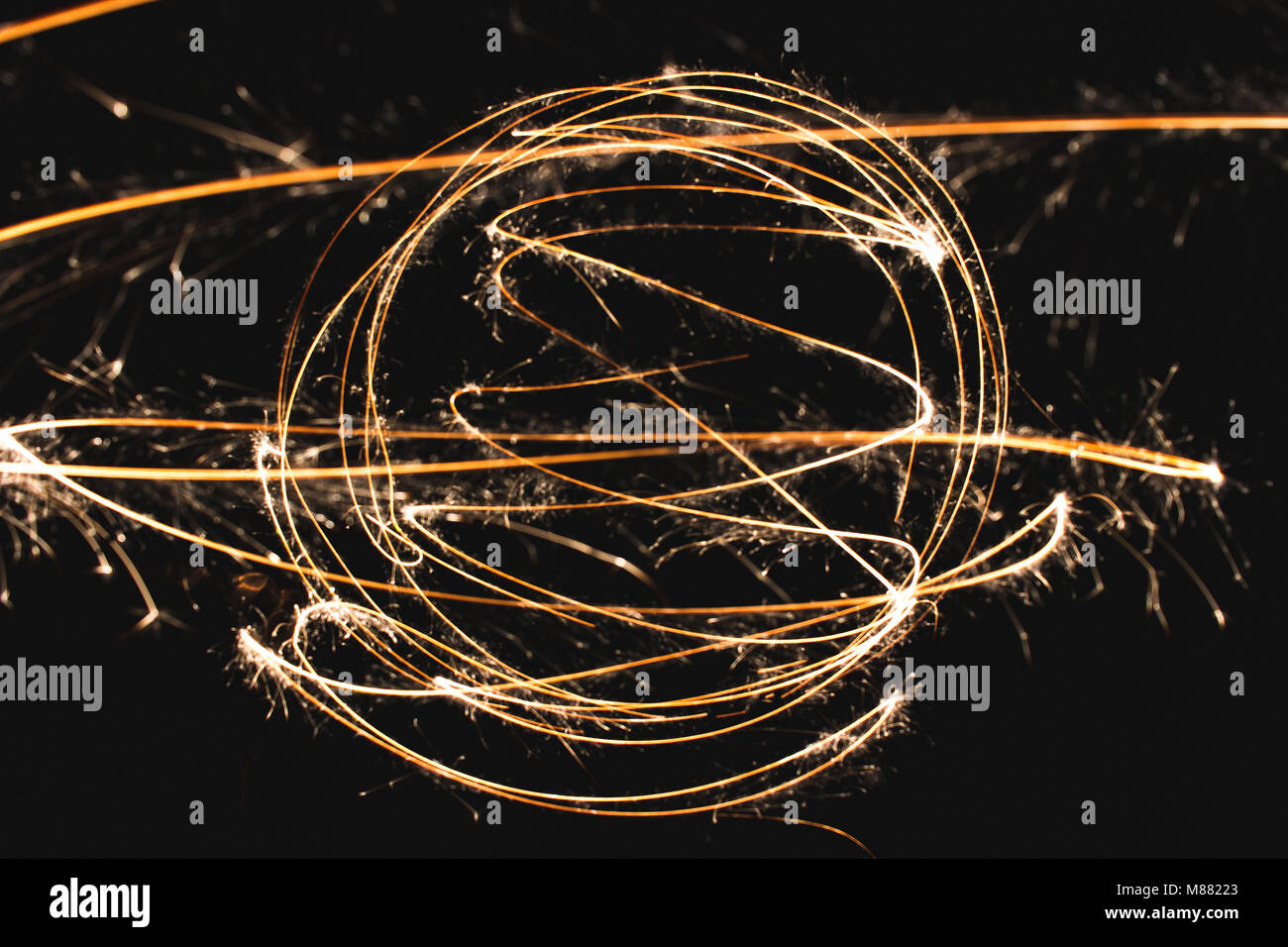Shapes made with a sparkler in a garden, using long exposure Stock ...