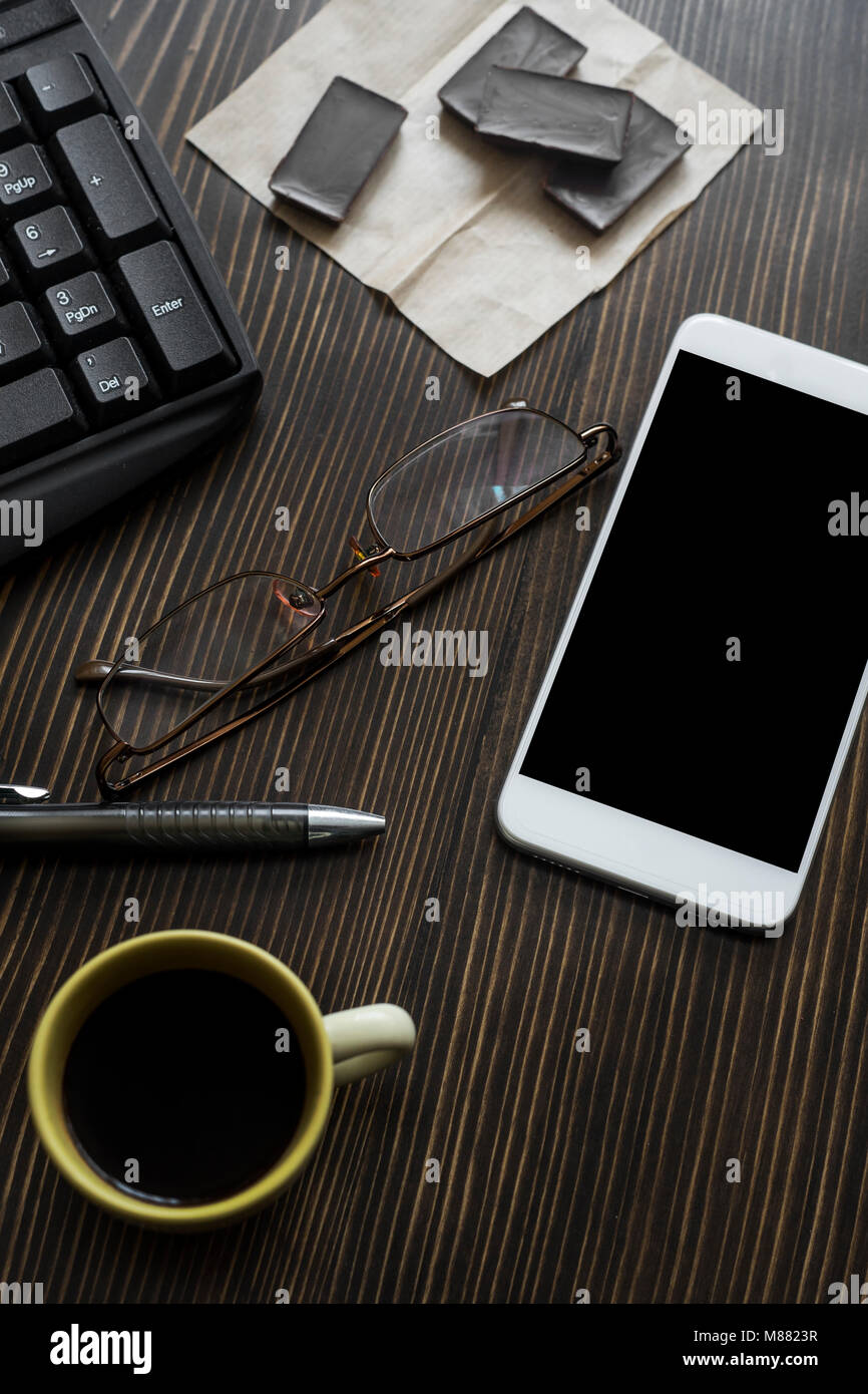 Working office desk in dark colors Stock Photo - Alamy