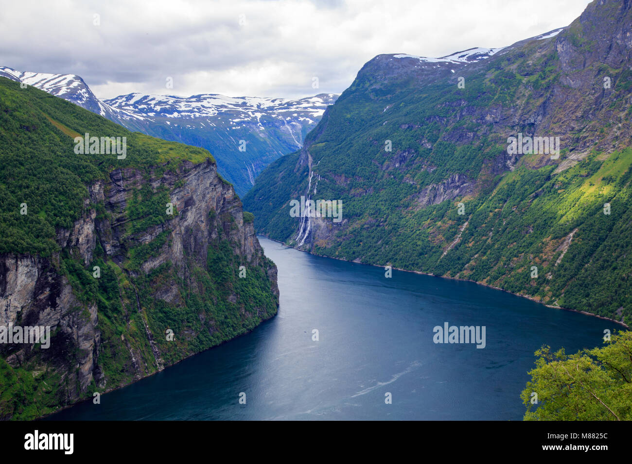 View of the mountains surrounding the Geirangerfjord in Geiranger ...