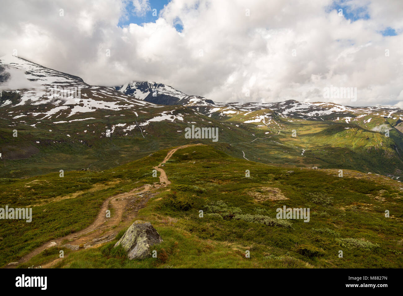hiking footpath leading into snowclad mountain view in Norway Stock ...