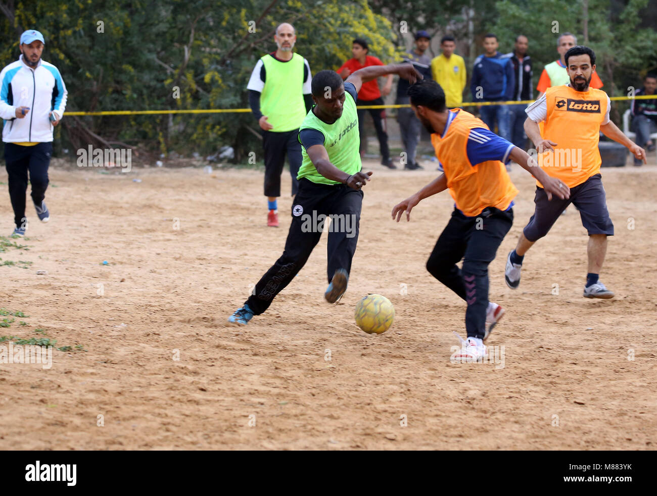 Tripoli, Libya. 6th Mar, 2018. Libyan young men play football during a ...