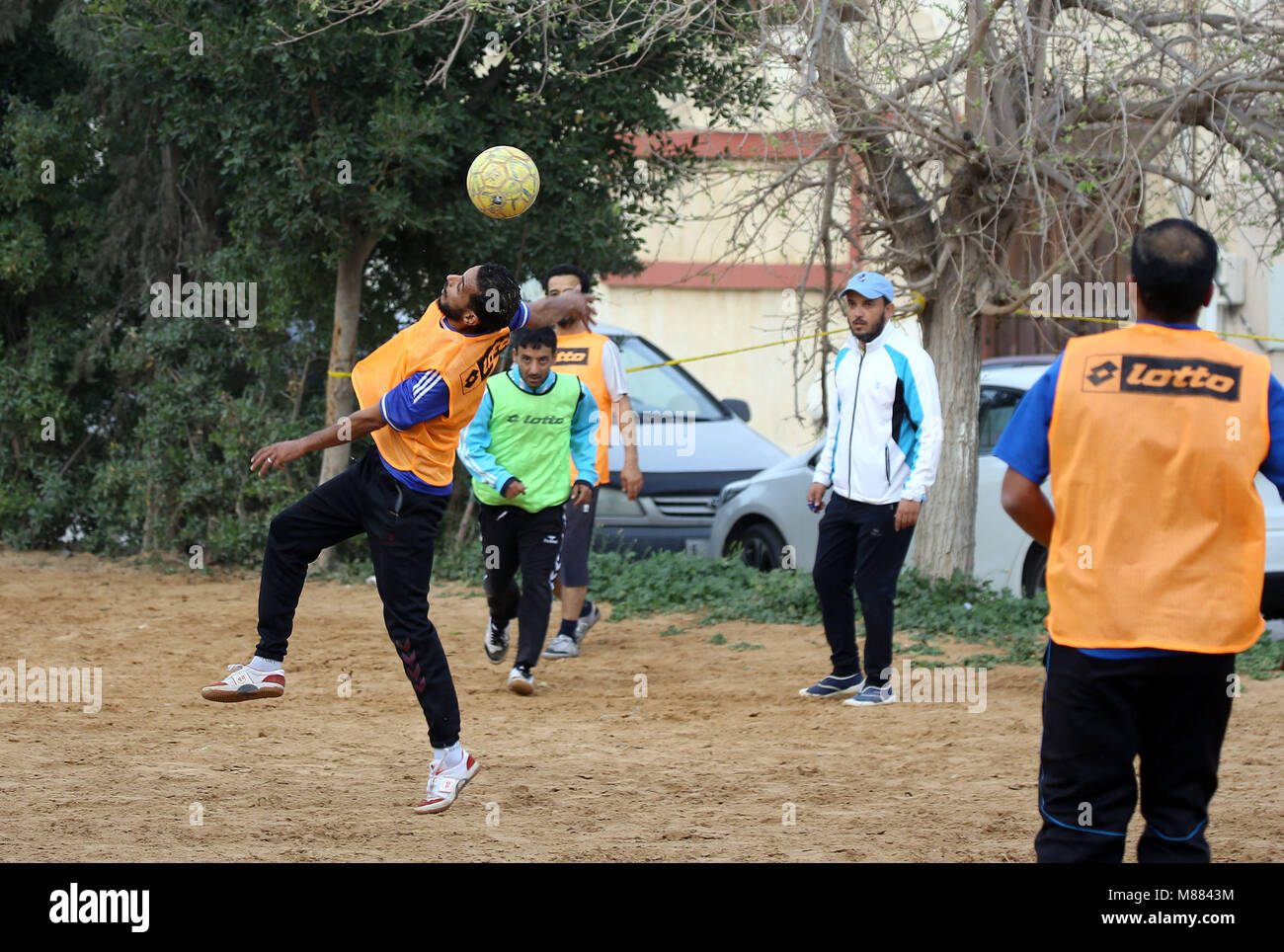 Tripoli, Libya. 6th Mar, 2018. Libyan young men play football during a ...