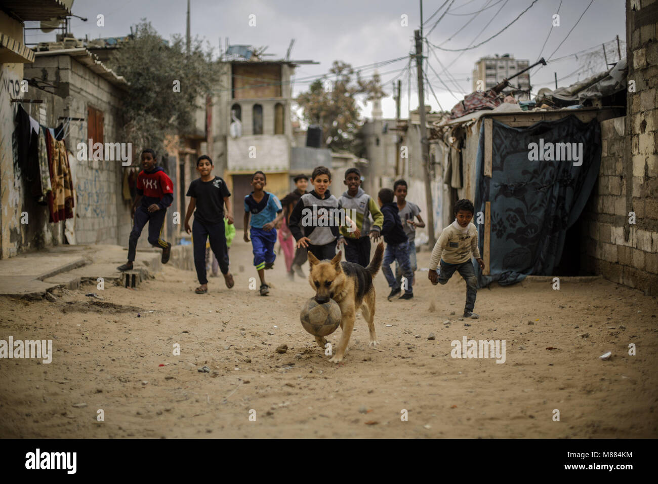 Gaza, Gaza Strip. 15th Mar, 2018. Palestinian children play football ...