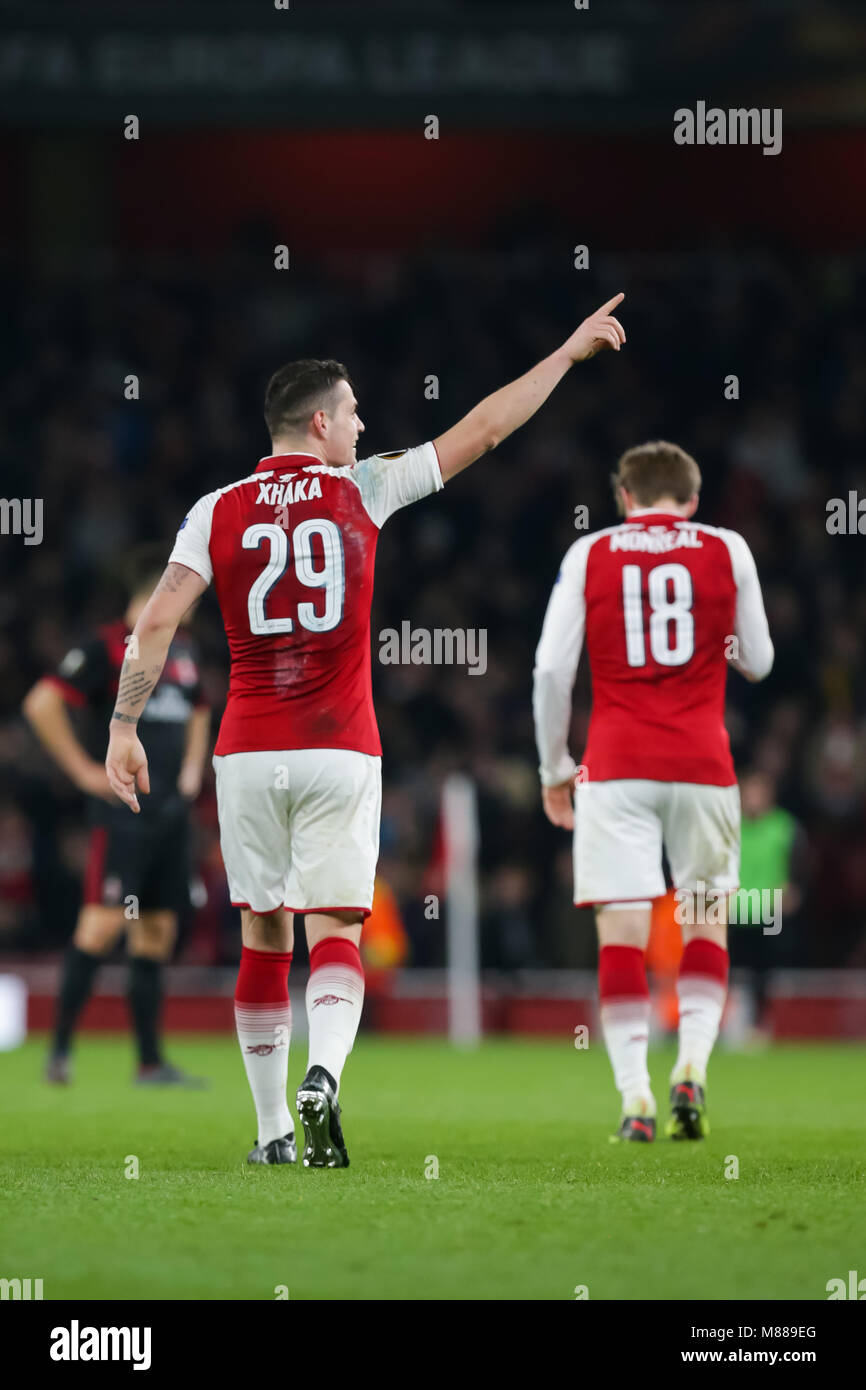 London, UK. 15th Mar, 2018. Granit Xhaka (L) of Arsenal celebrates ...