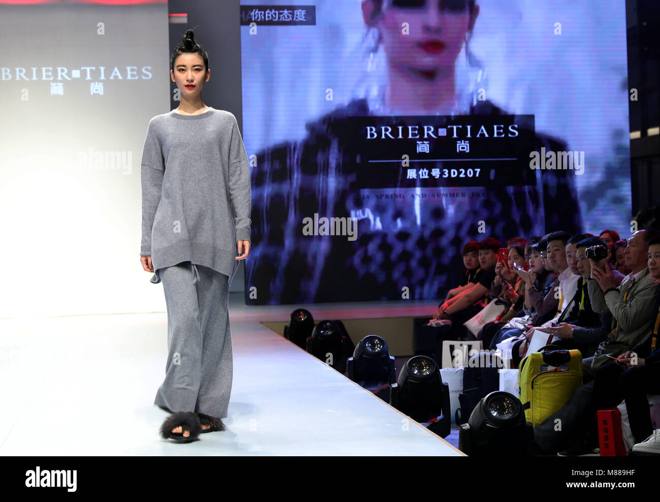 Shanghai, China. 15th Mar, 2018. A model presents a creation of sweater ...