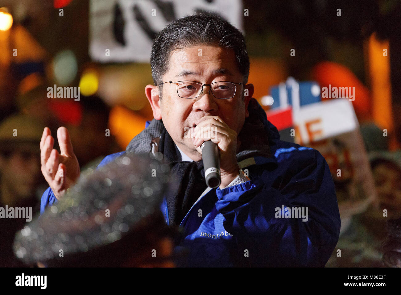 Japanese politician Akira Koike speaks during a protest in front of the ...