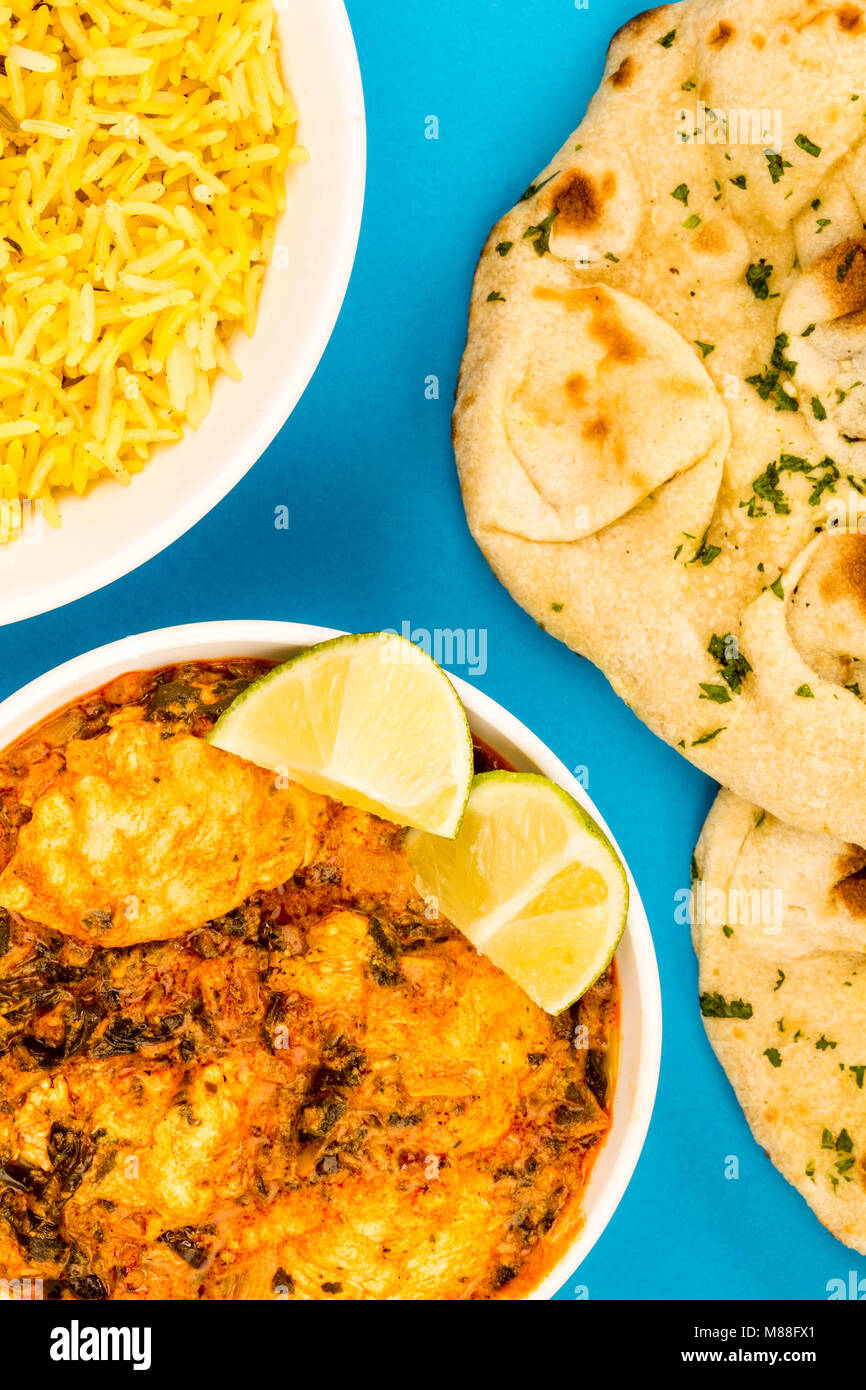 Indian Style Chicken Saag Masala Curry Against A Blue Background With ...