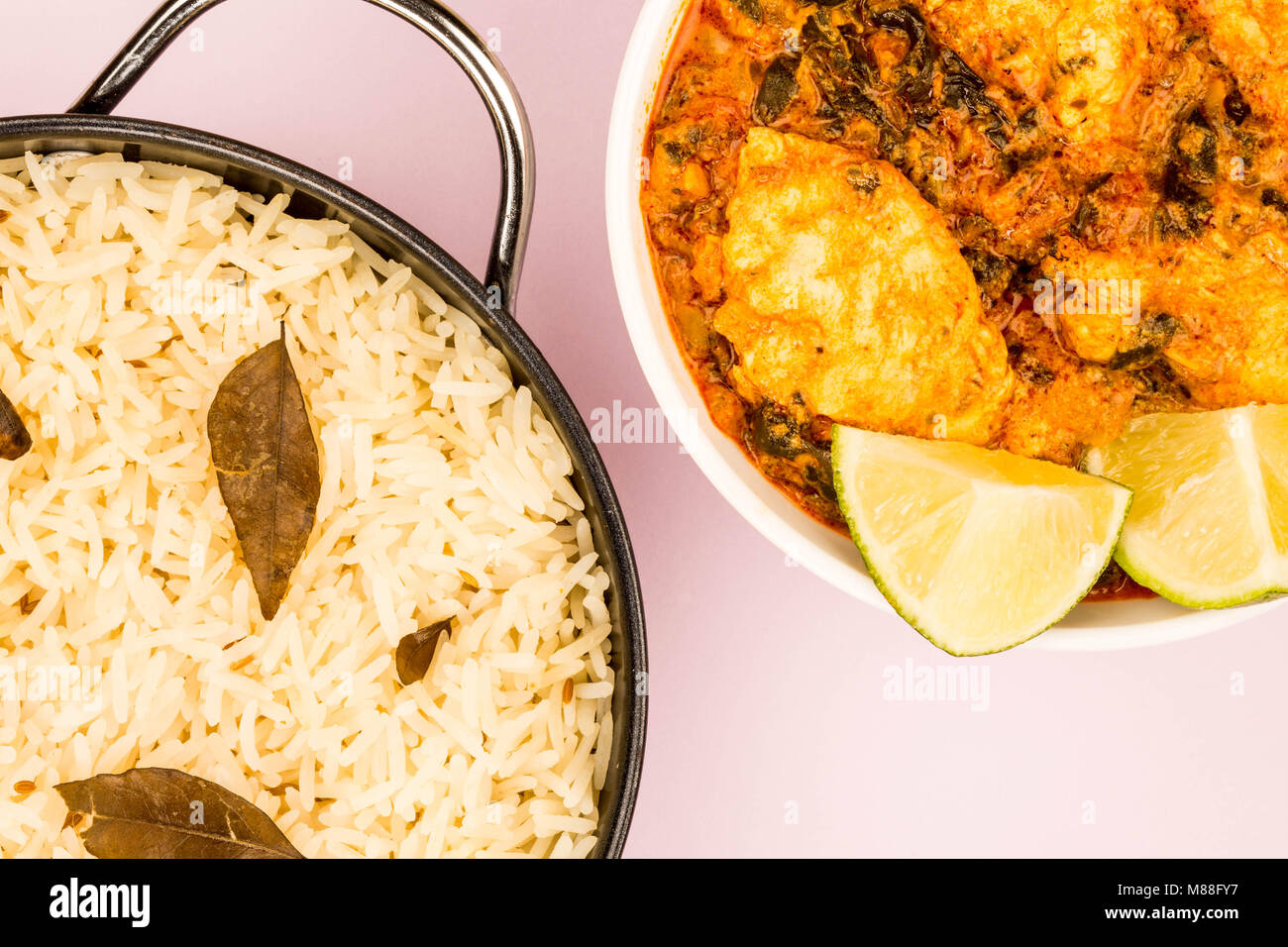 Indian Style Chicken Saag Masala Curry Against A Pink Background With ...