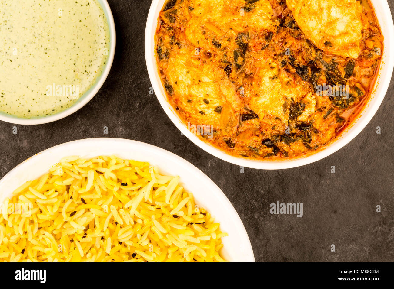 Indian Style Chicken Saag Masala Curry Against A Black Background With ...