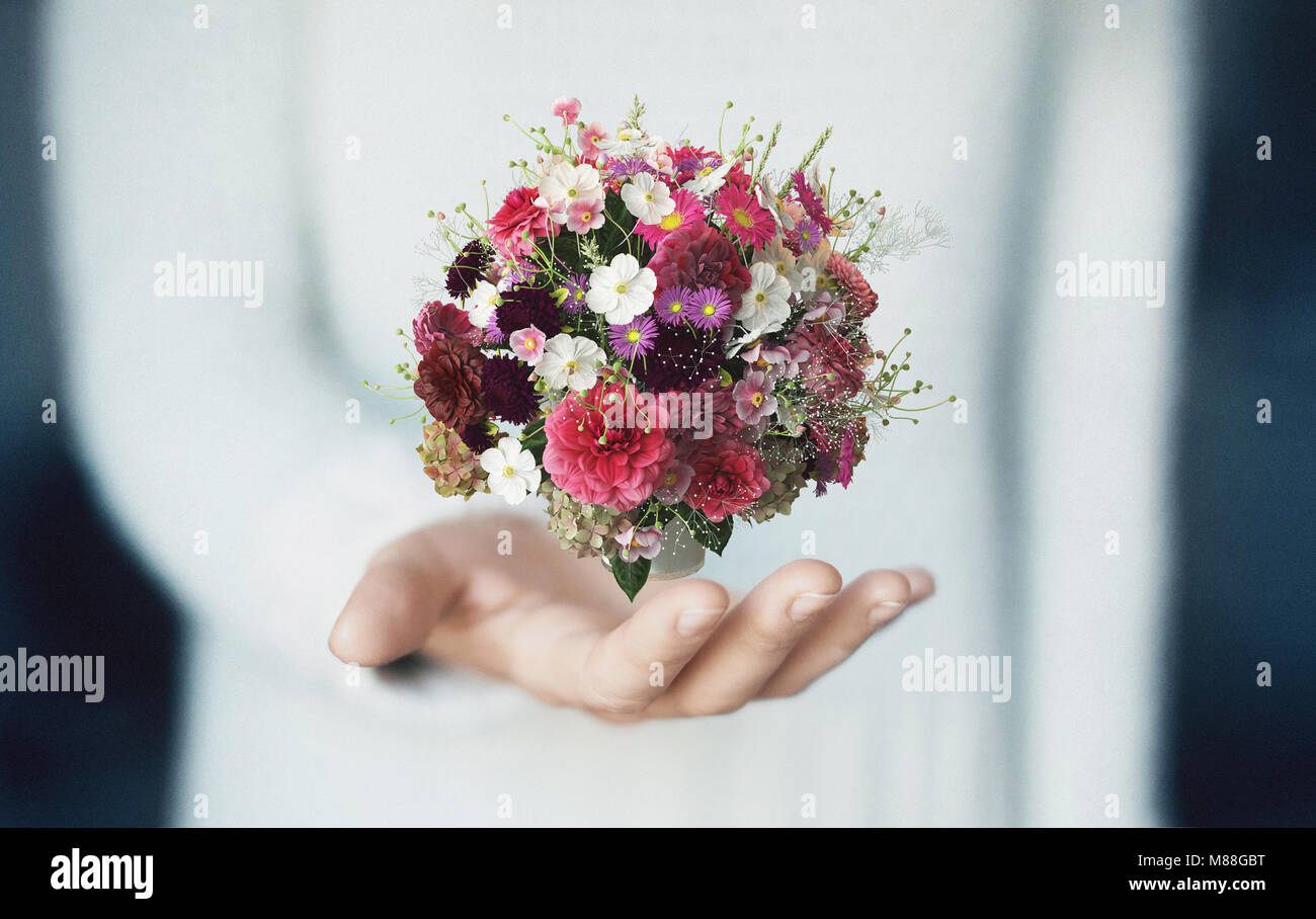 Hand and flowers hi-res stock photography and images - Alamy