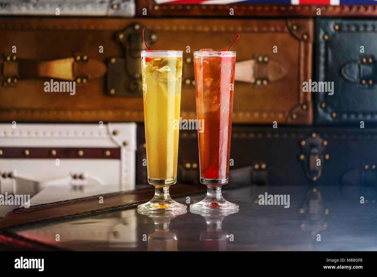 Classic cocktails long drink with orange and cherry served on a bar ...