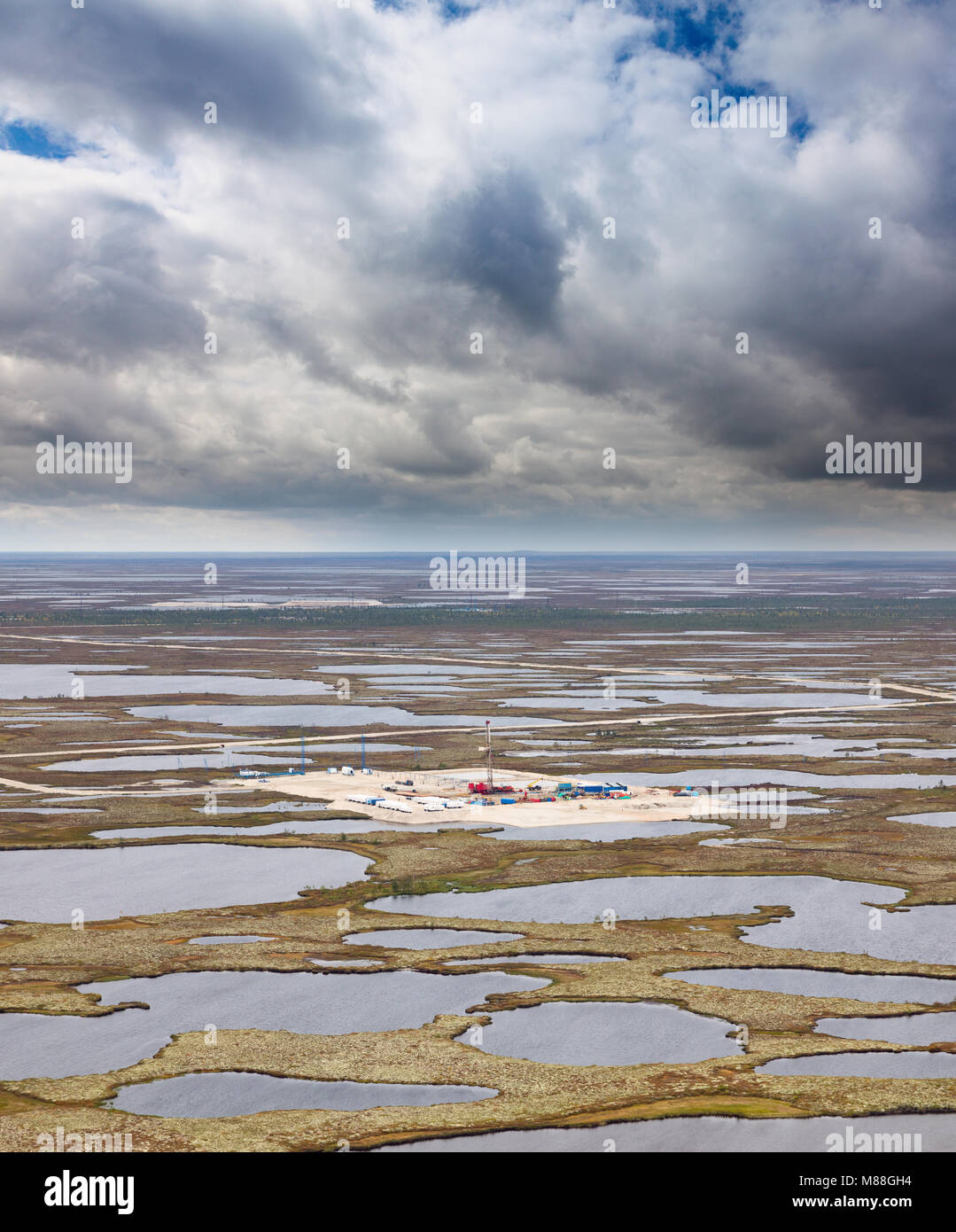 Aerial view of oilfield on impassable swamp area Stock Photo - Alamy