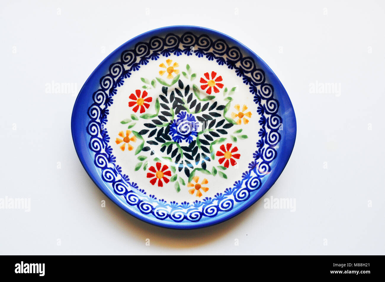 Blue plate. Polish ceramics Stock Photo - Alamy