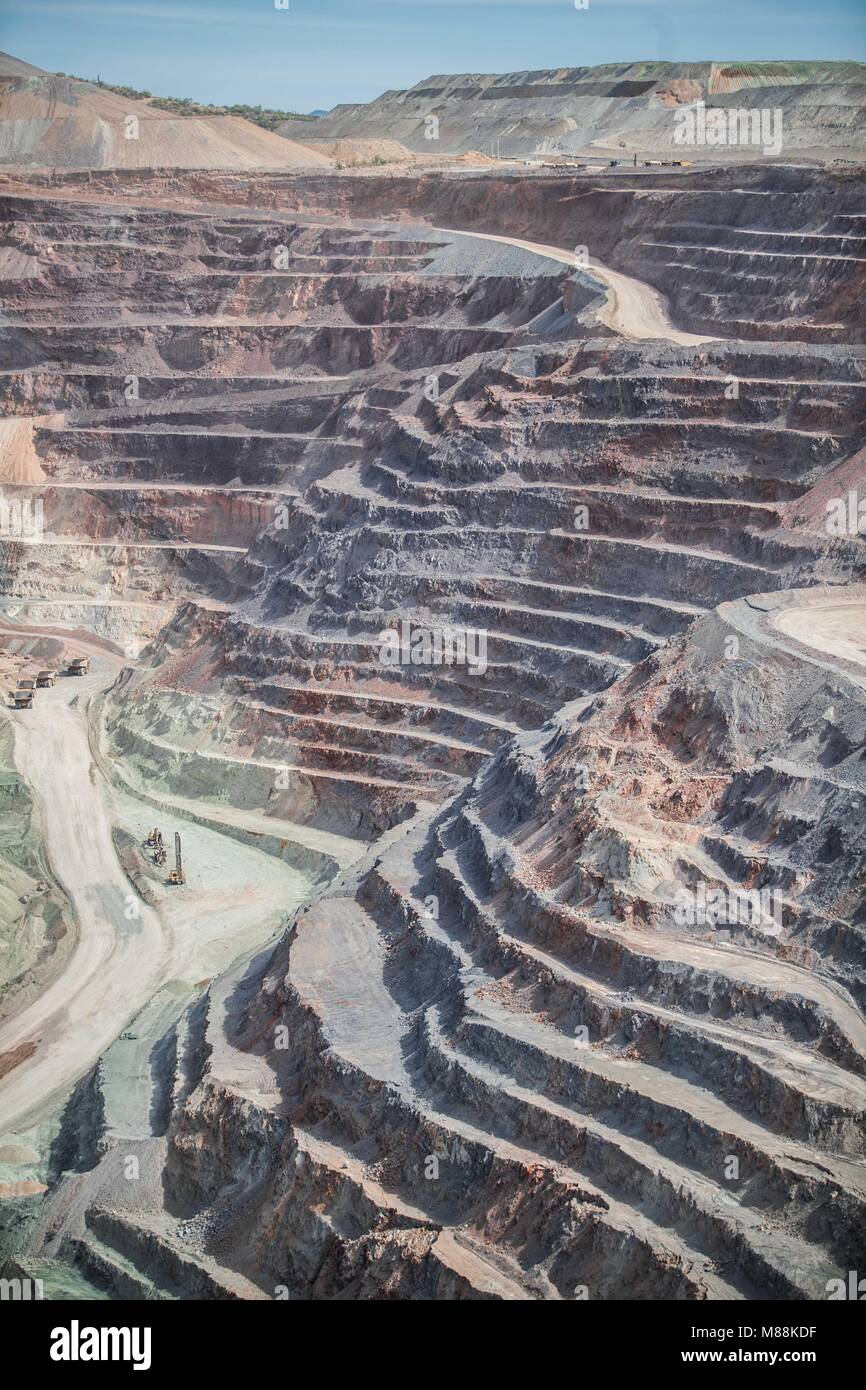 Panoramic view of open pit mine and blue sky located in the desert of ...