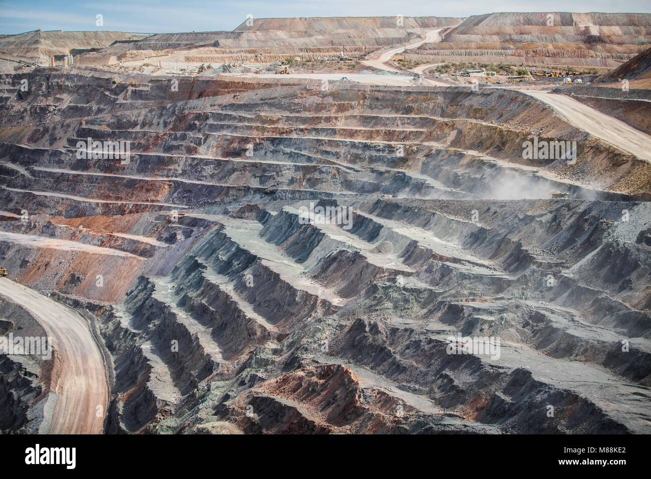 Panoramic view of open pit mine and blue sky located in the desert of ...