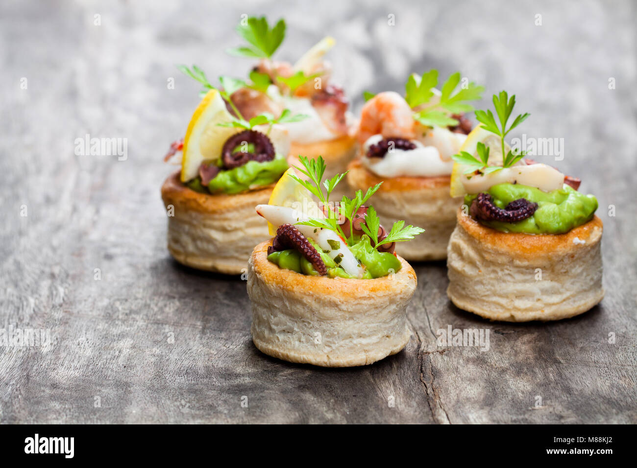 Vol-au-vents puff pastry cases filled with salted squid and octopus ...