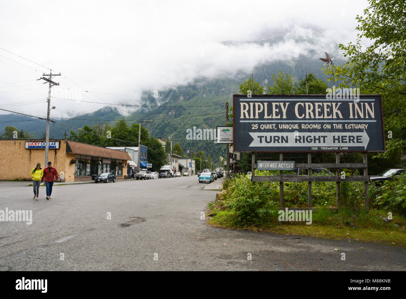 Two residents of the community of Stewart, British Columbia, cross the ...