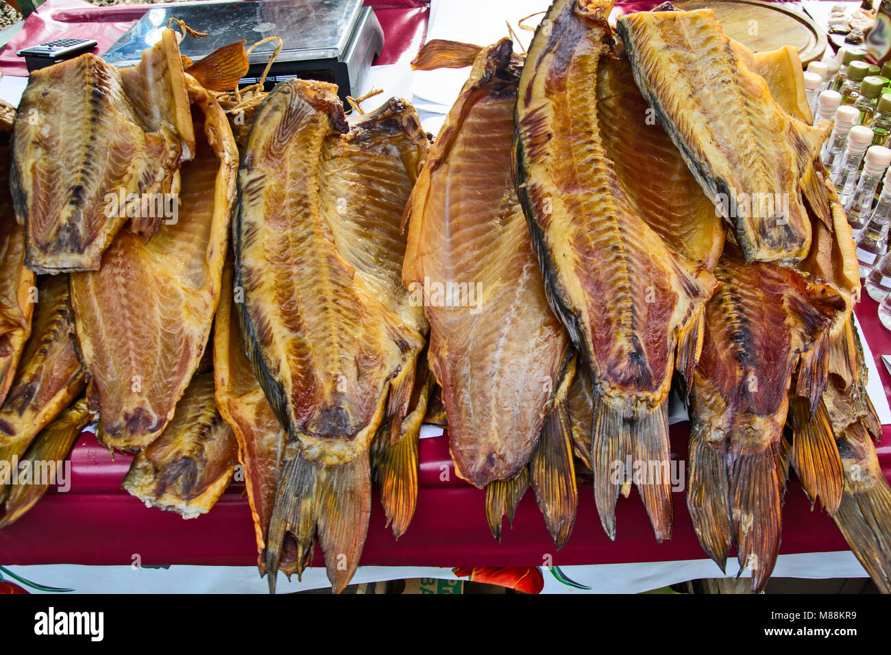 The specialty of fish market carp smoked and dried Stock Photo - Alamy