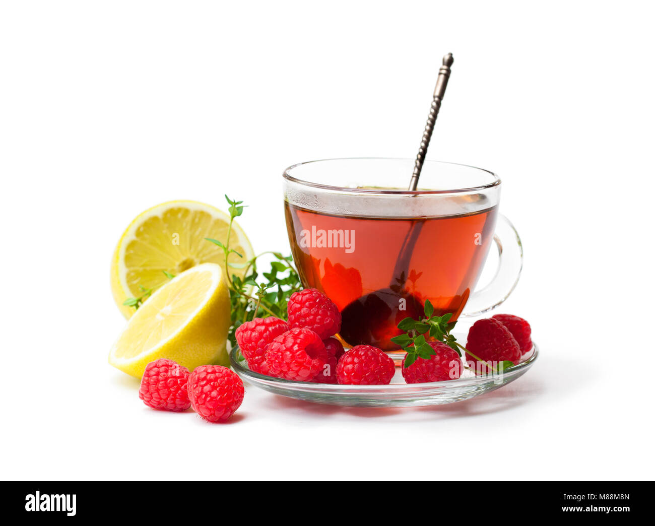 Red fruit tea with lemon and raspberry isolated on white background ...