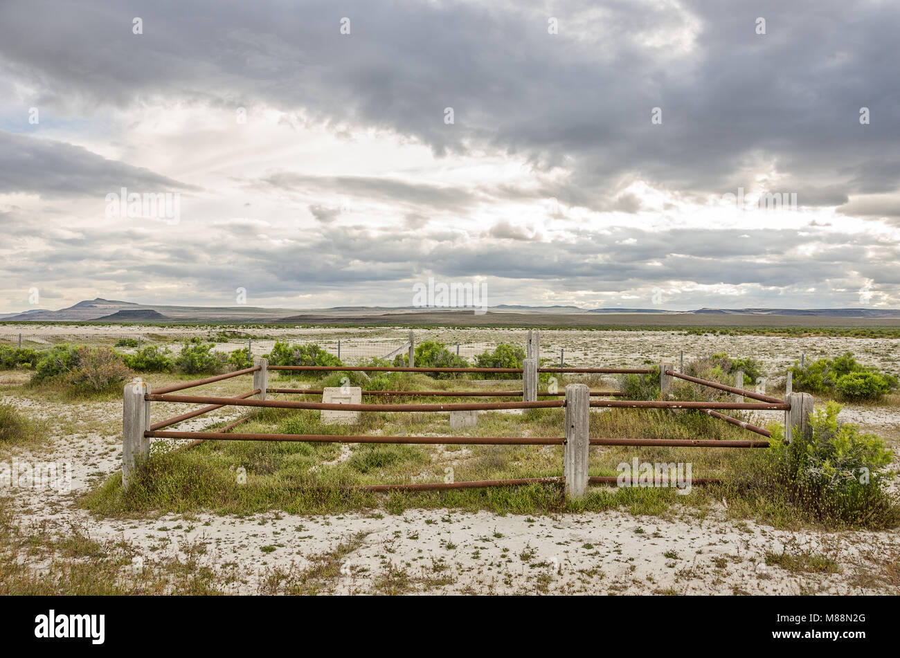 Part of an old cemetery with at least two tombstones enclosed with ...