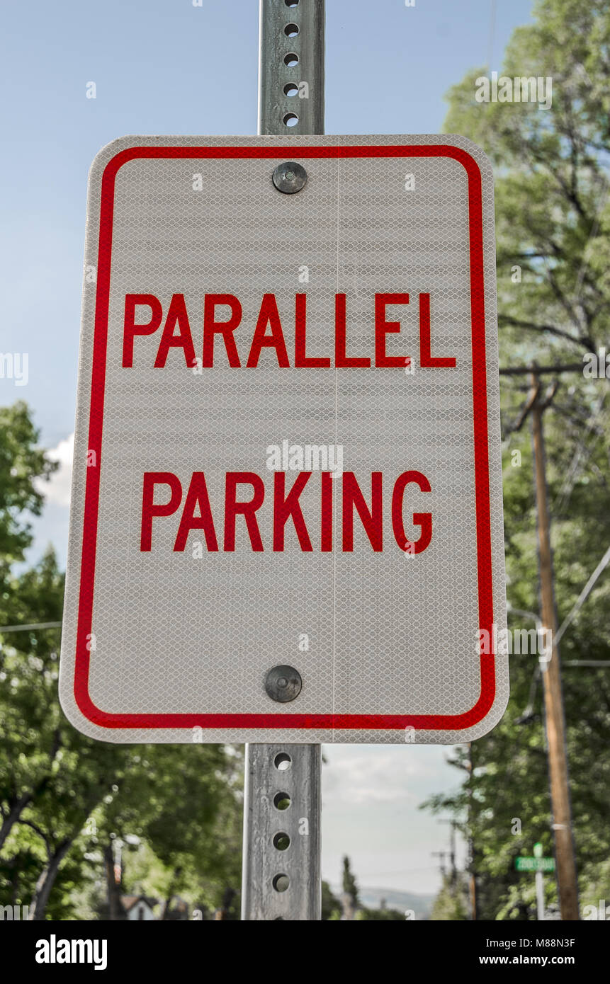 Red and white parallel parking sign found in a small town Stock Photo ...